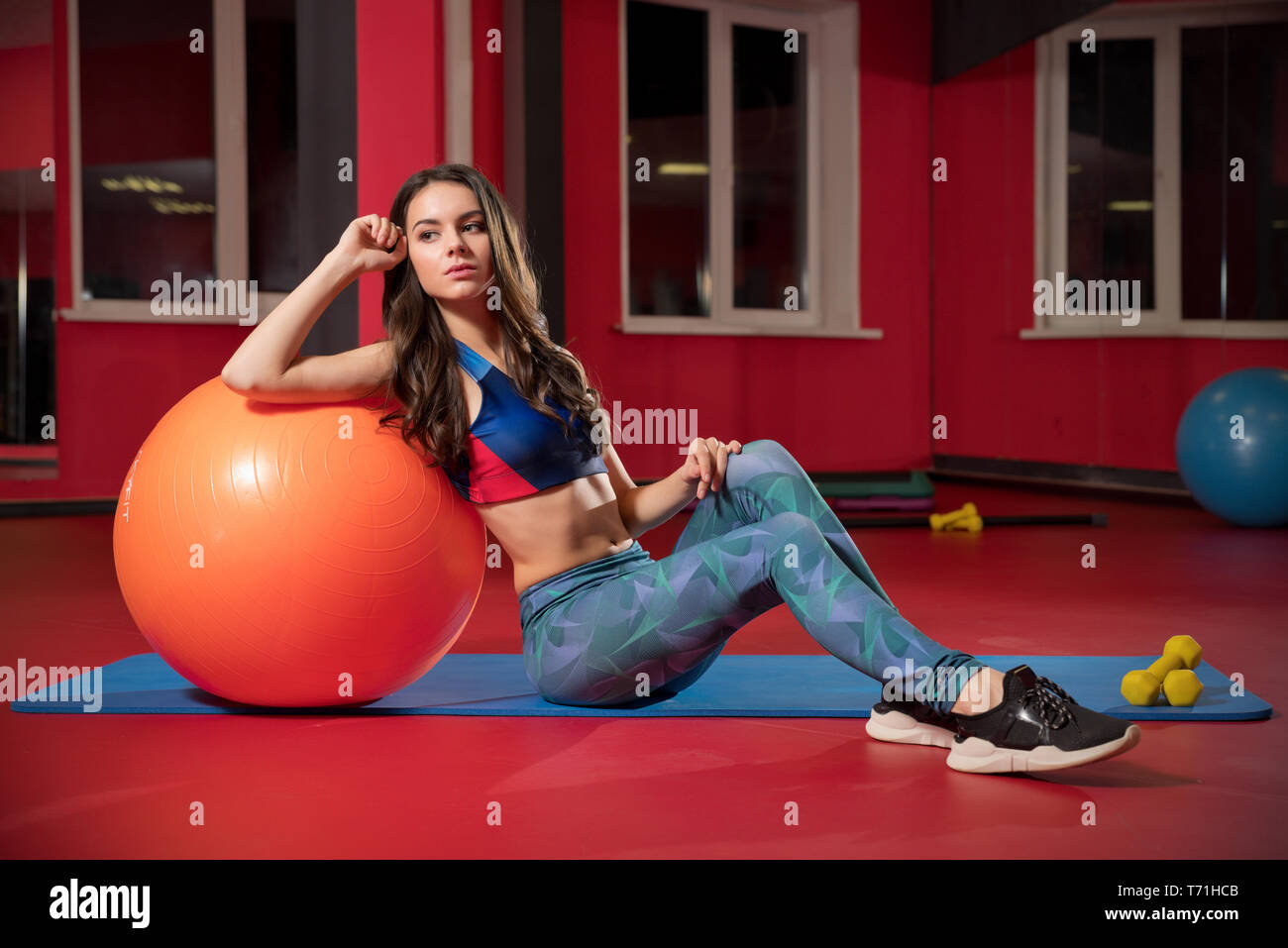 Young woman in fitness club Stock Photo - Alamy