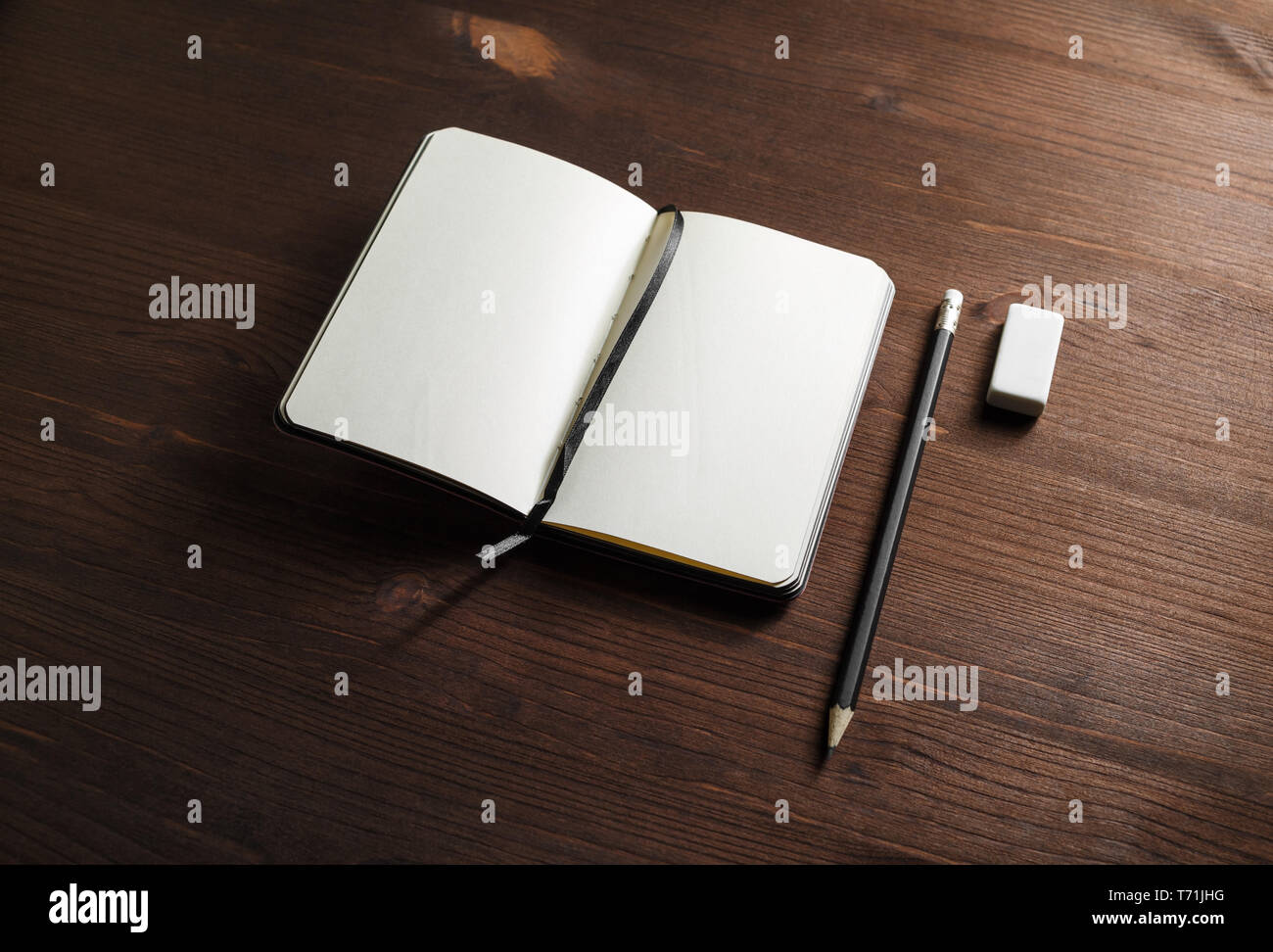 Notebook, pencil, eraser Stock Photo - Alamy