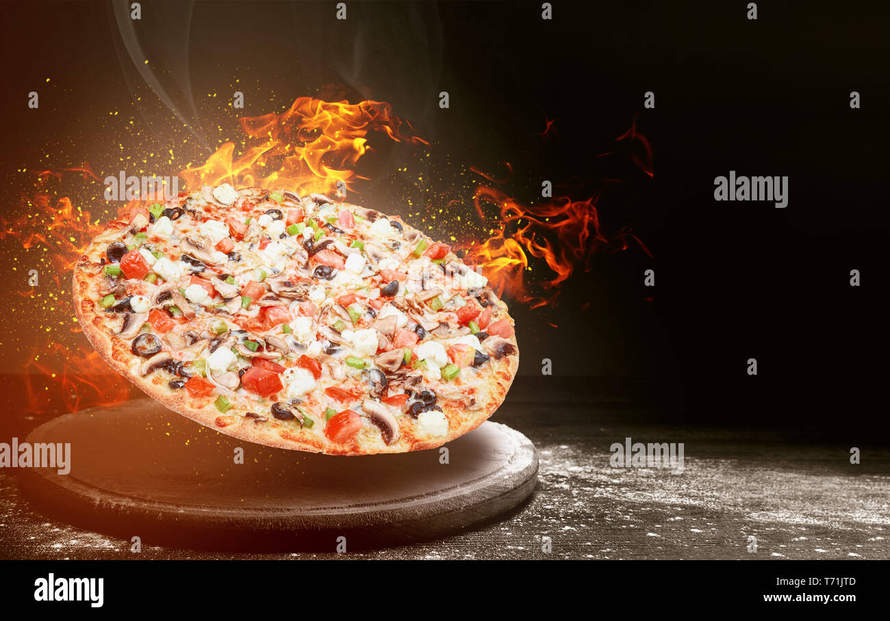 fast food pizza on fire. high quality fast food concept Stock Photo - Alamy