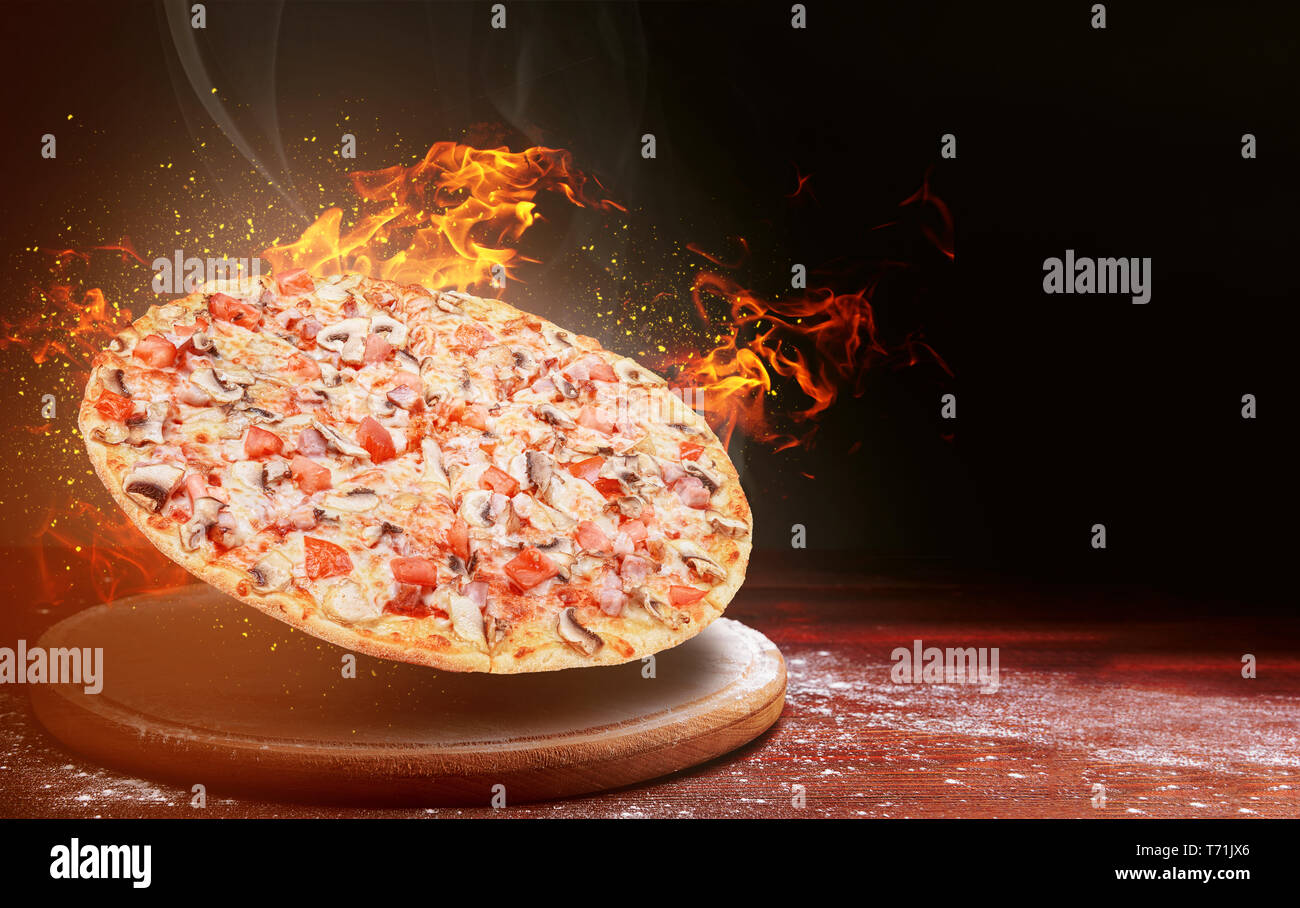 fast food pizza on fire. high quality fast food concept Stock Photo - Alamy