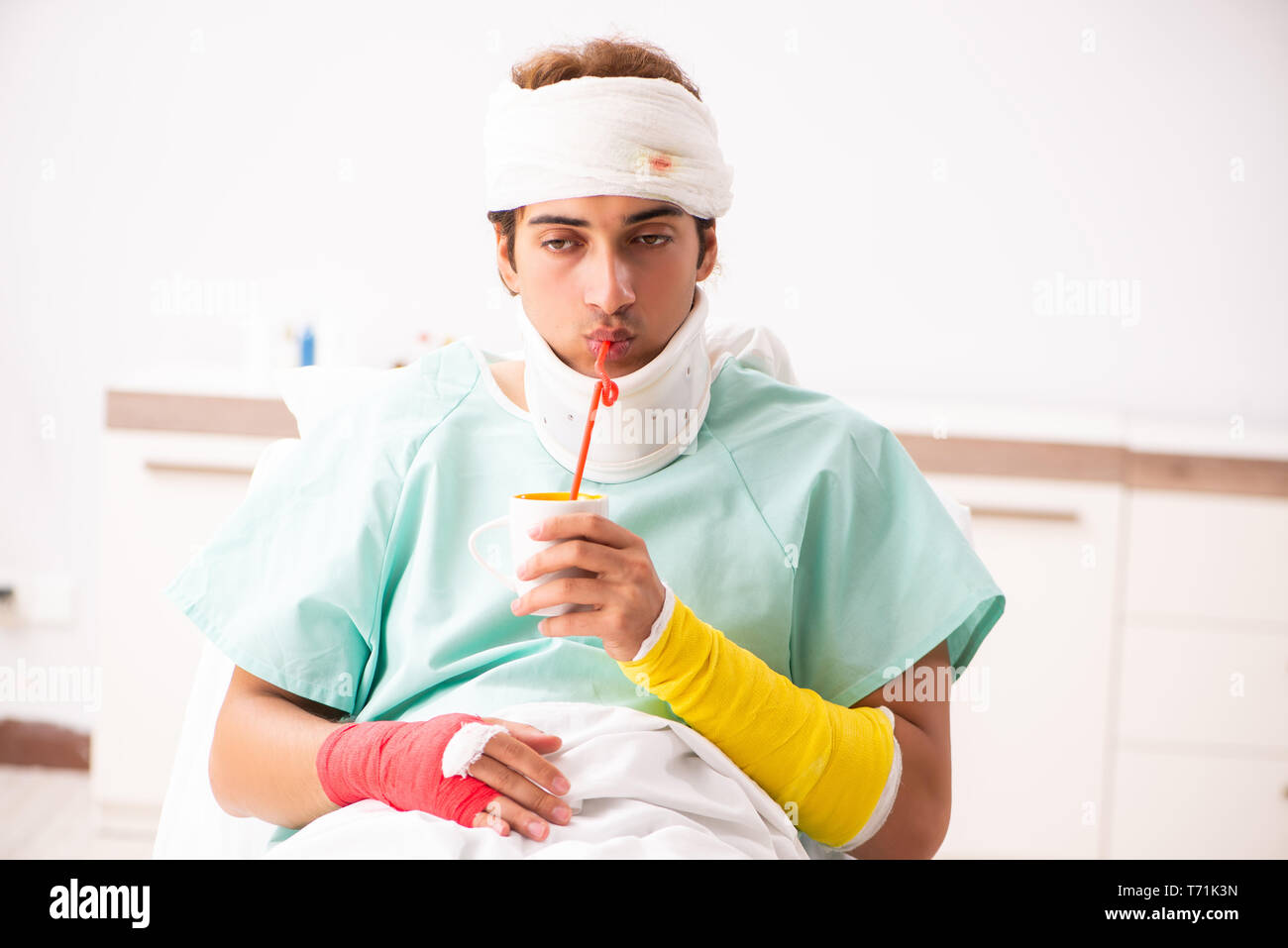 Young injured man staying in the hospital Stock Photo - Alamy