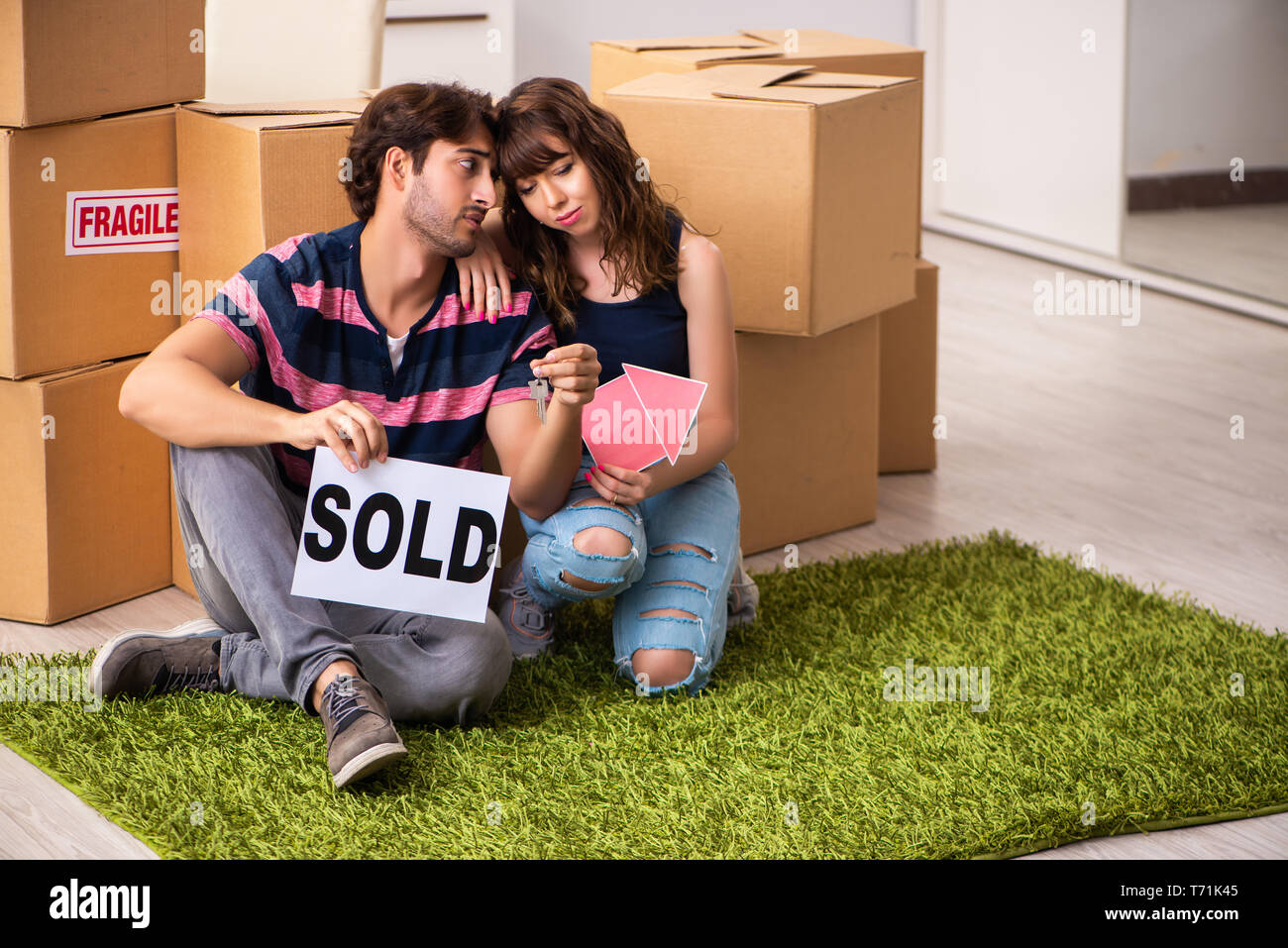 Young family selling their house Stock Photo - Alamy