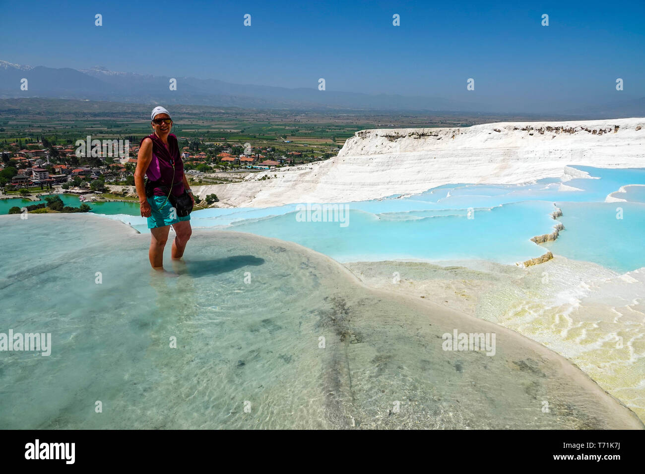 Tourists at Pamukkale hot springs and travertine pools, UNESCO world ...
