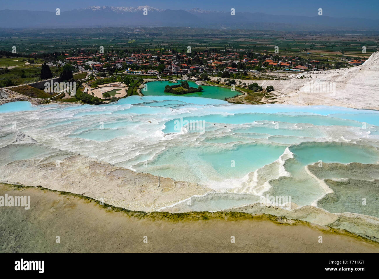 Tourists at Pamukkale hot springs and travertine pools, UNESCO world ...