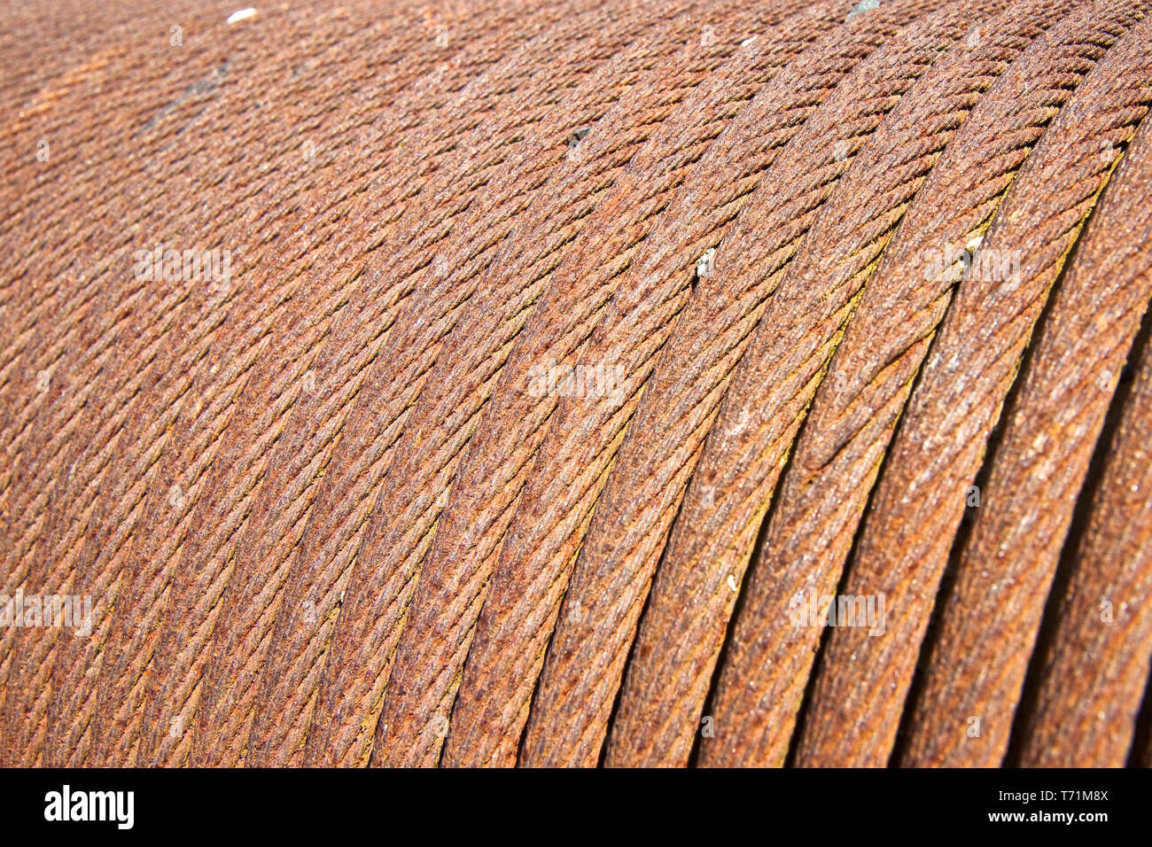 Old steel cable wrapped up in a coil - full frame background Stock ...