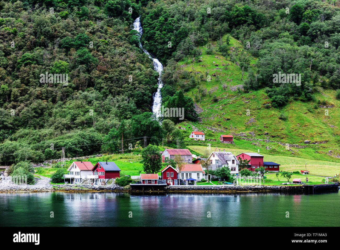 Reflection of small town in norwegian fiord, Norway Stock Photo - Alamy