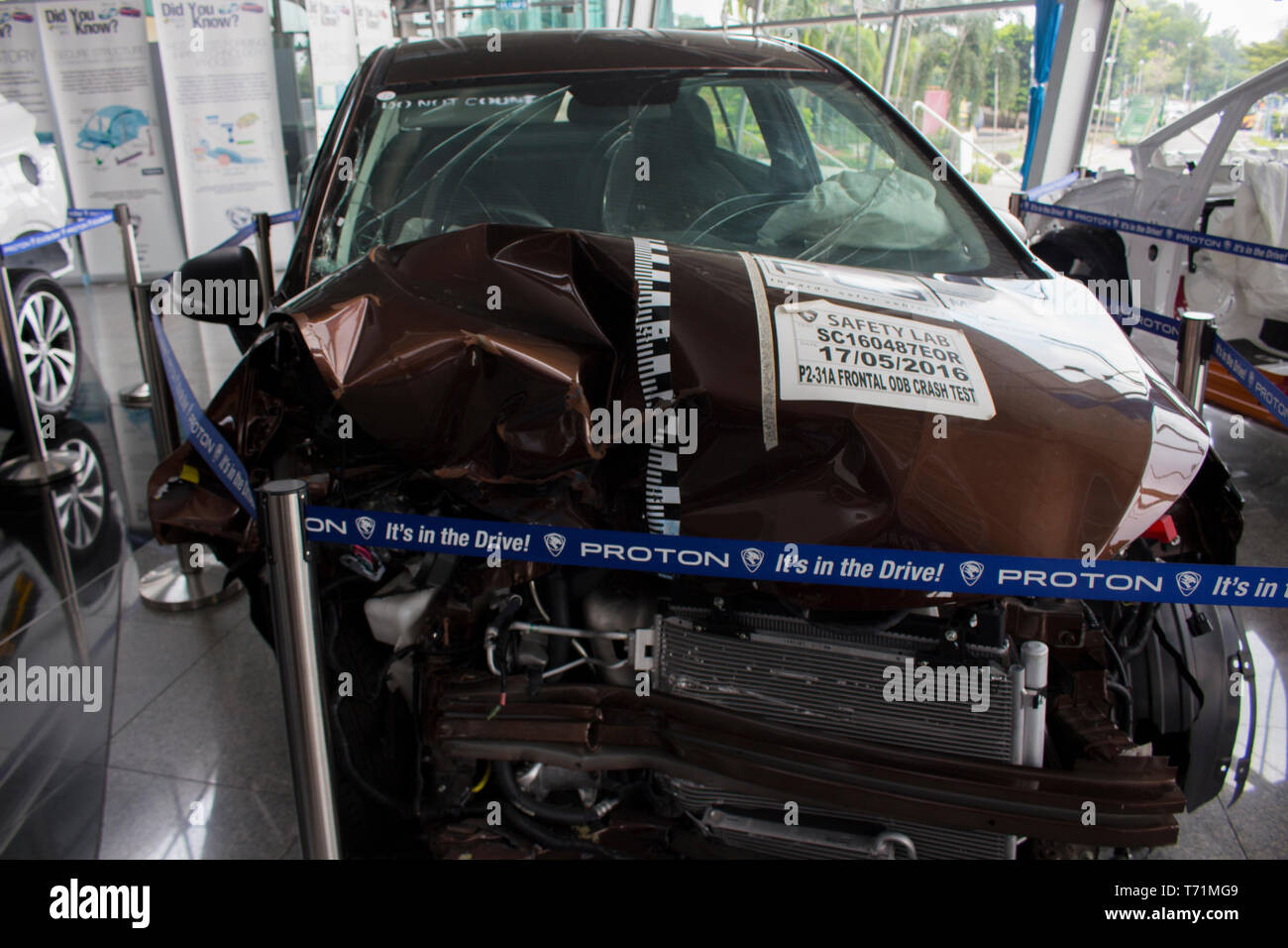 Proton damaged car for show inside the main company Stock Photo - Alamy