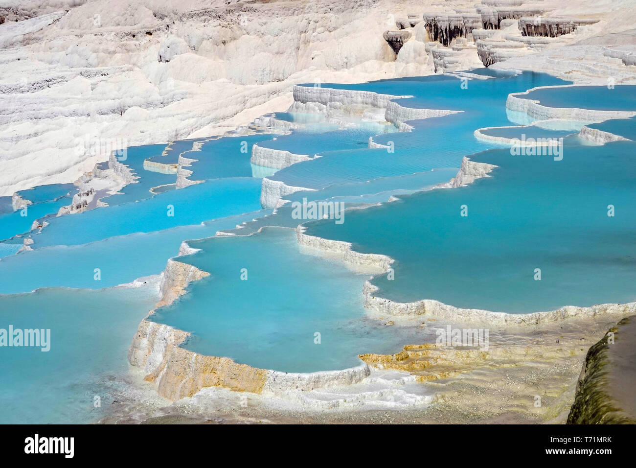 Tourists at Pamukkale hot springs and travertine pools, UNESCO world ...