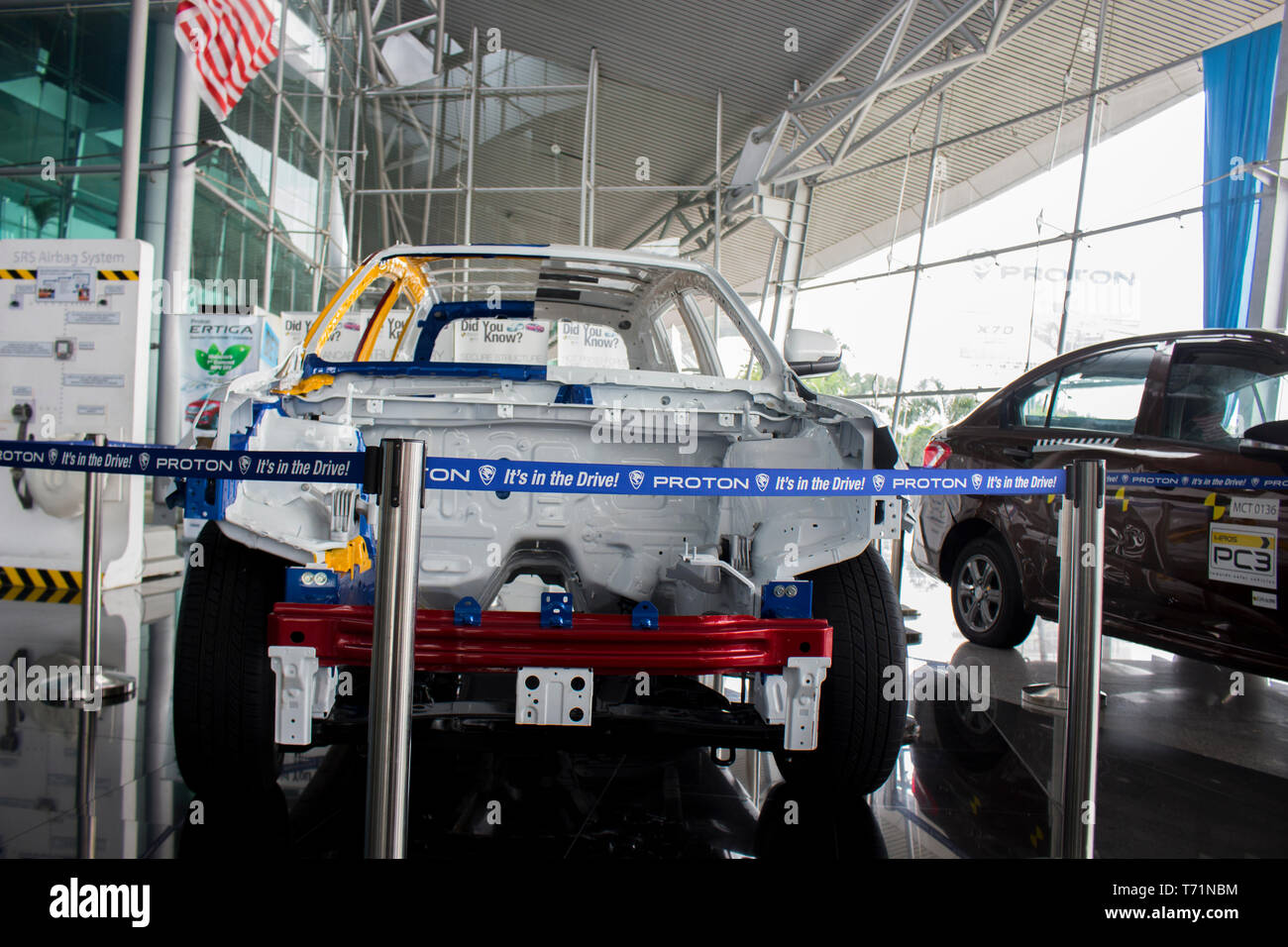 Proton damaged car for show inside the main company Stock Photo - Alamy