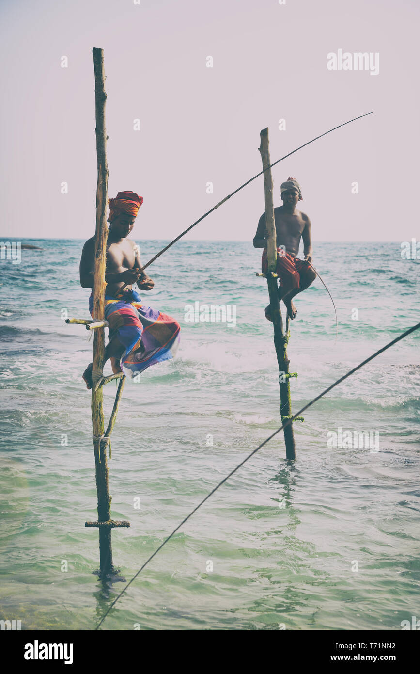 The local fishermen are fishing in unique style Stock Photo - Alamy