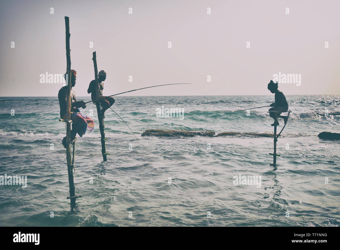 The local fishermen are fishing in unique style Stock Photo - Alamy