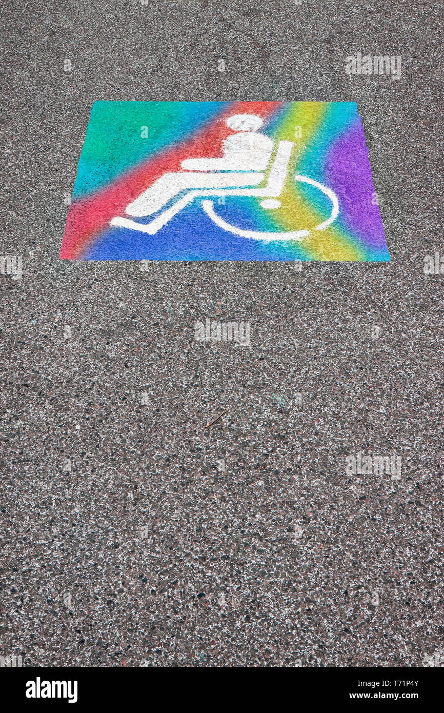 Colored symbol of the handicapped person painted on the asphalt Stock ...