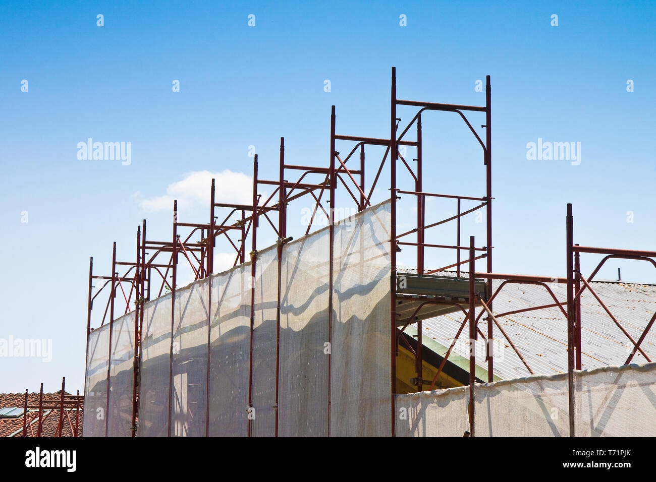 Metal scaffolding for the restoration of a building in a italian ...