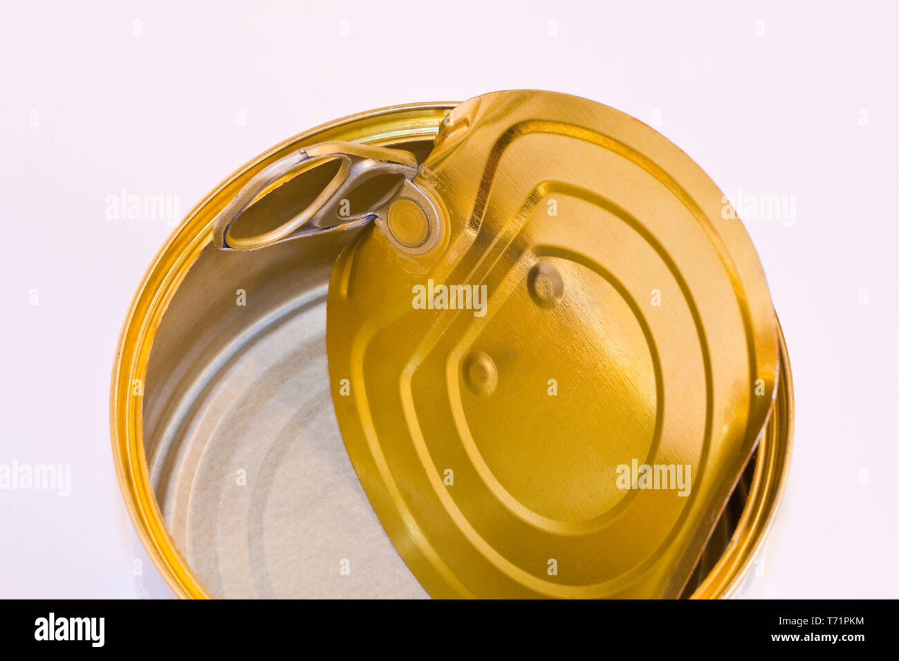 Opened metal box for corned beef on bright background Stock Photo - Alamy