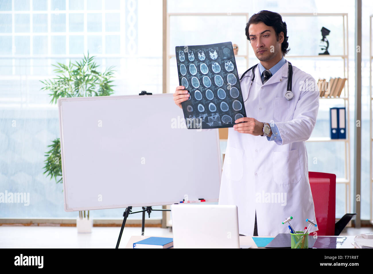 Young handsome male radiologist in front of whiteboard Stock Photo - Alamy