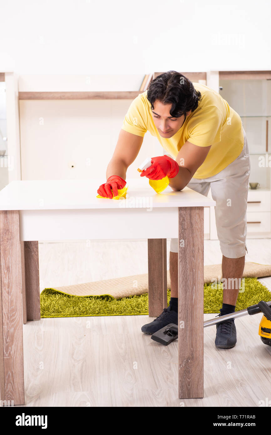 Young handsome man doing housework Stock Photo - Alamy