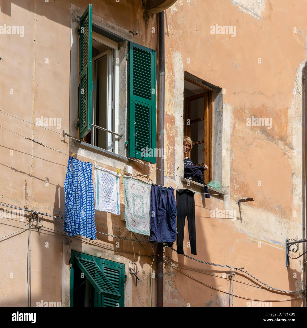 Woman hanging out washing hi-res stock photography and images - Alamy