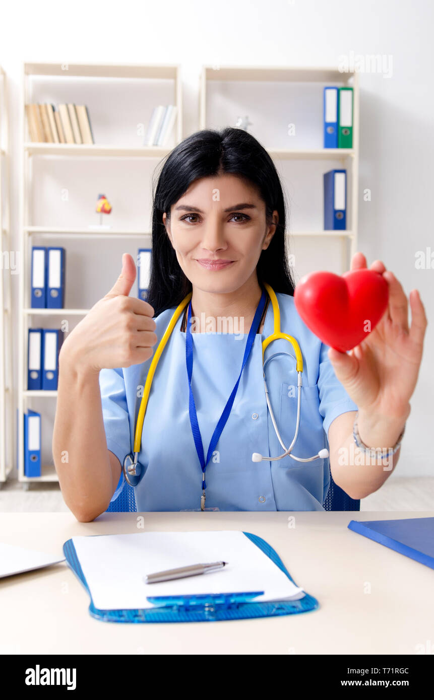 Female doctor cardiologist working in the clinic Stock Photo - Alamy