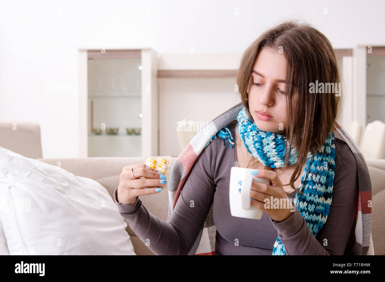 Sad sick young woman drinking hi-res stock photography and images - Alamy