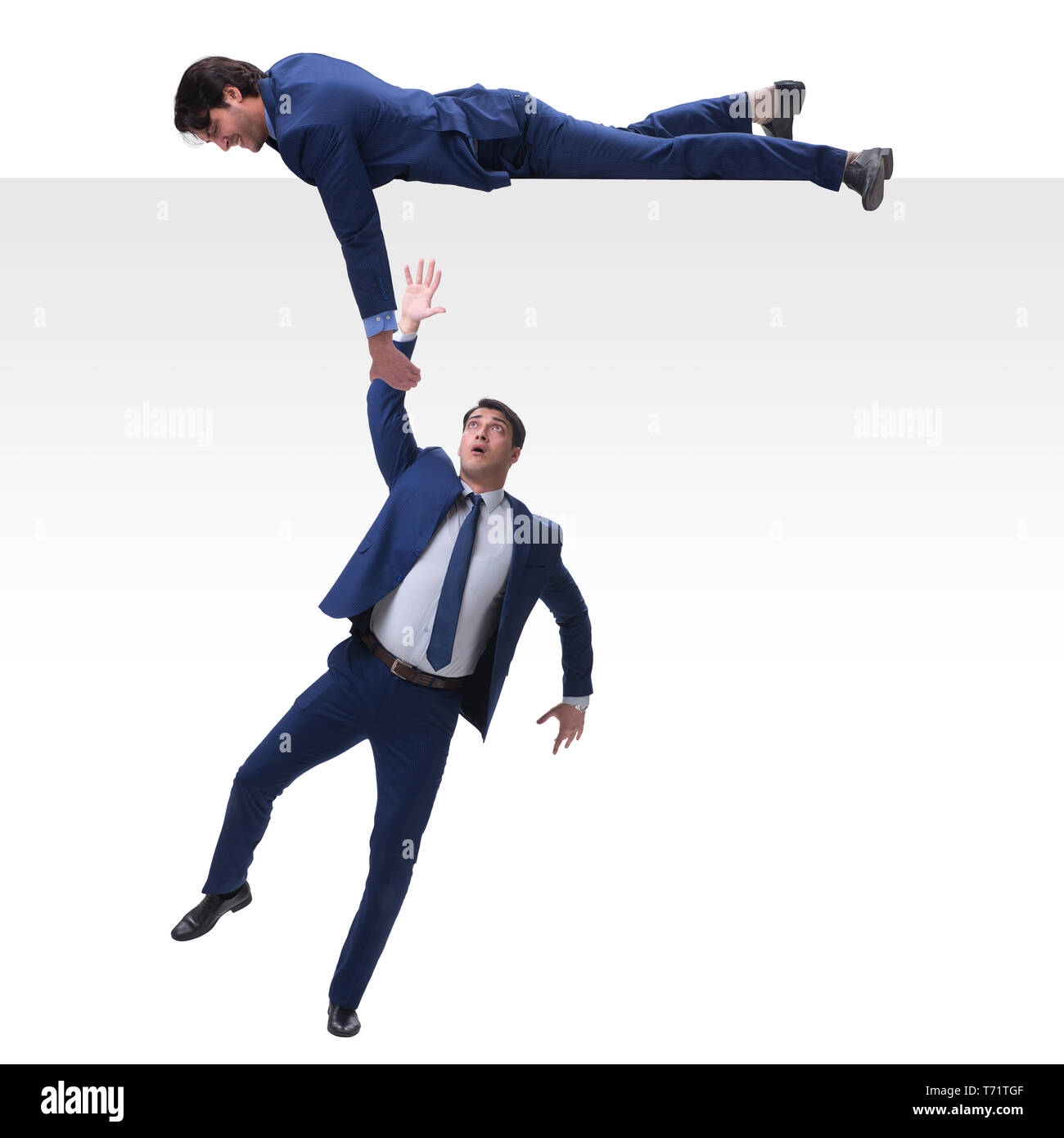 Businessman pulling falling hi-res stock photography and images - Alamy