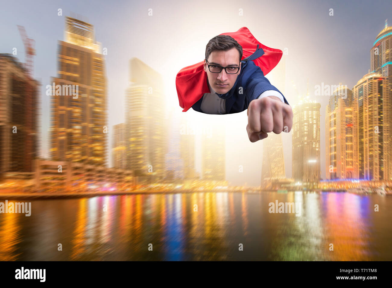 Superhero businessman flying over the city Stock Photo - Alamy