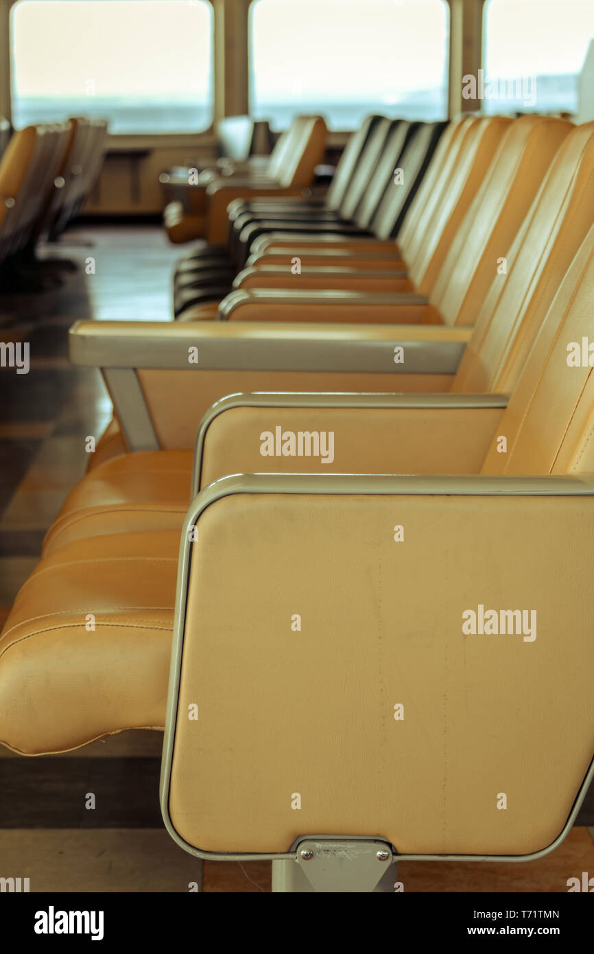 The vintage yellow seats on a Puget Sound ferry on route from Seattle ...