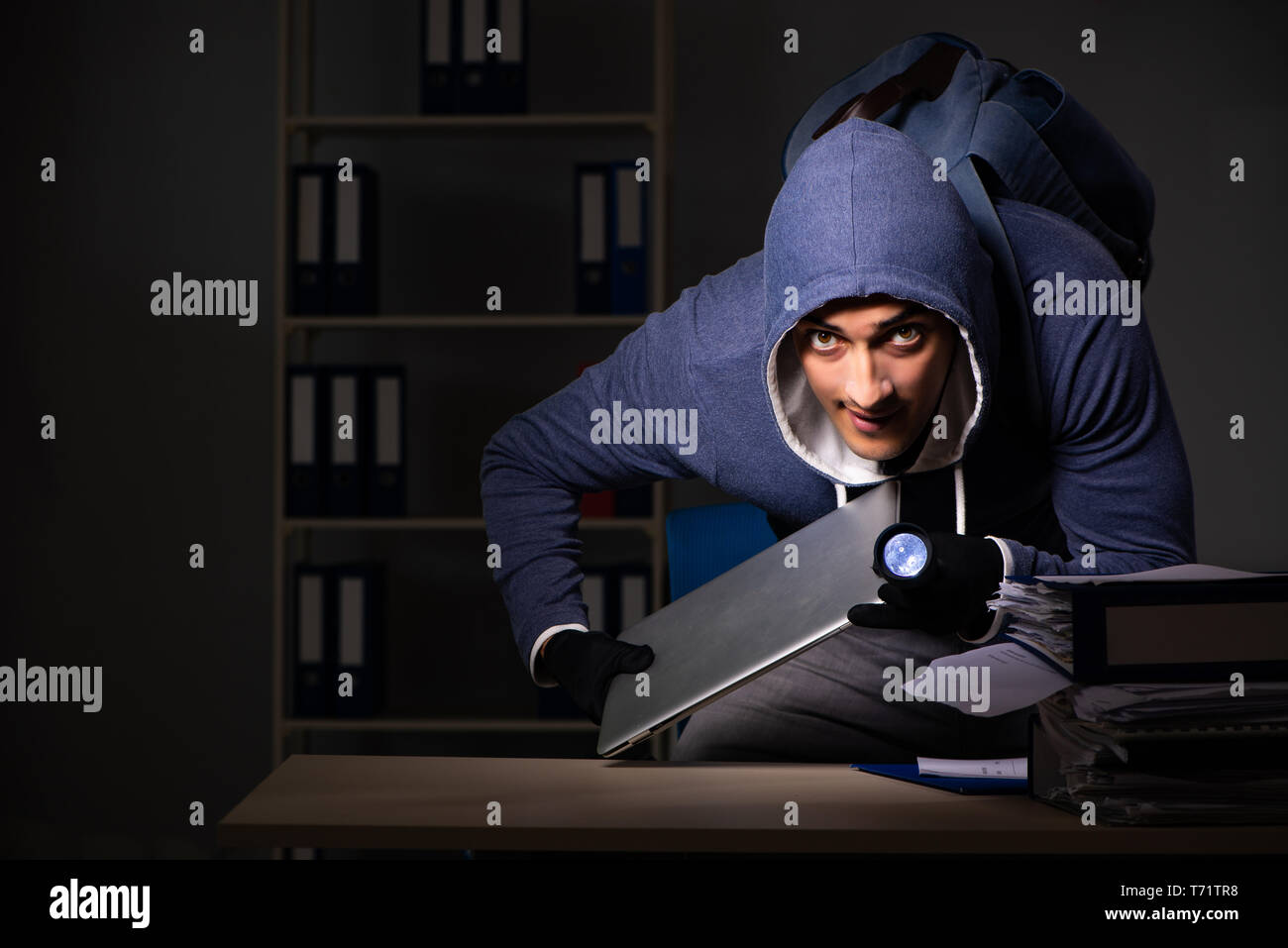 Thief trying to steal personal data in identity theft concept Stock ...