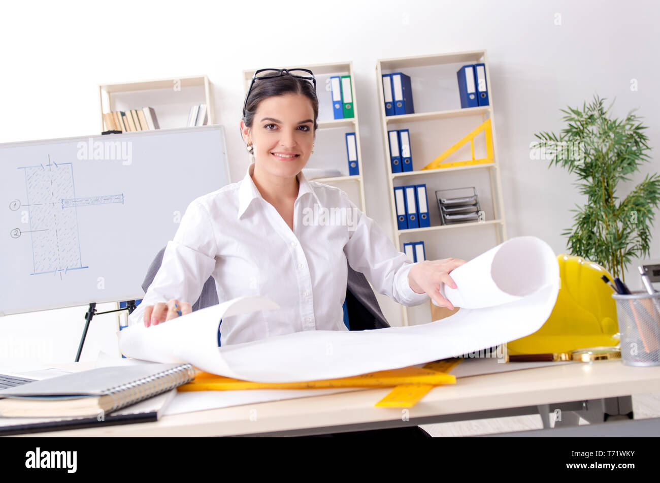 Female architect working in the office Stock Photo - Alamy