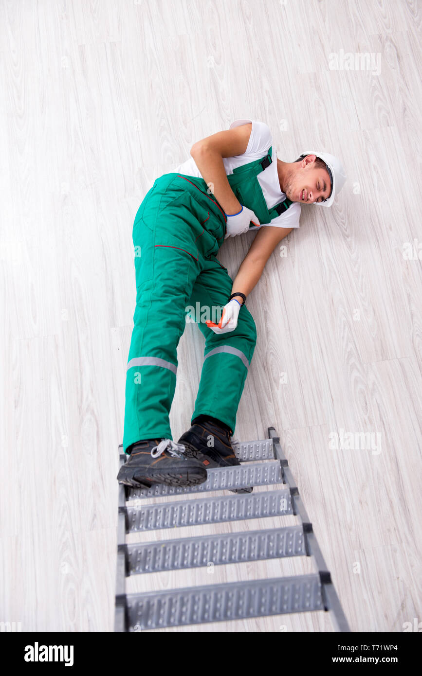 Young worker falling from the ladder Stock Photo - Alamy