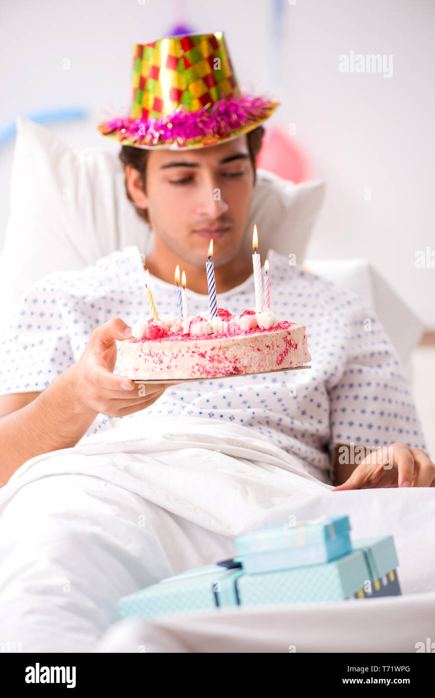 Young man celebrating his birthday in hospital Stock Photo - Alamy