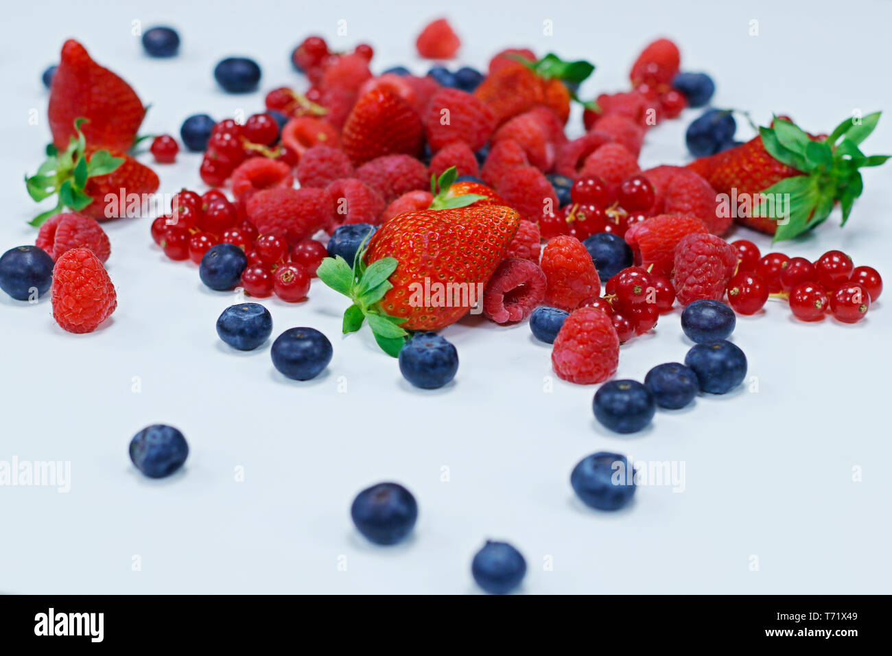 assorted fresh berries with white background Stock Photo - Alamy