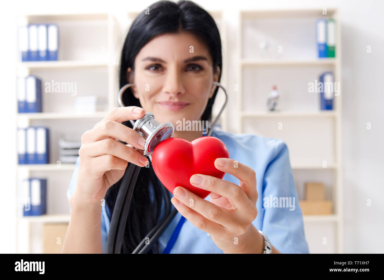 Female doctor cardiologist working in the clinic Stock Photo - Alamy