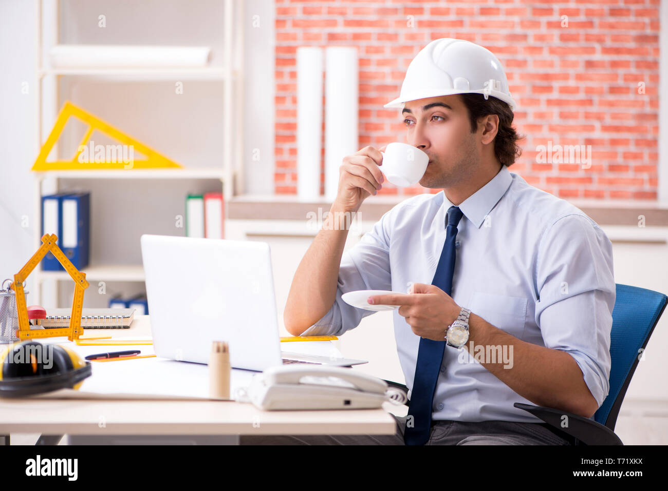 Construction supervisor working on blueprints Stock Photo - Alamy