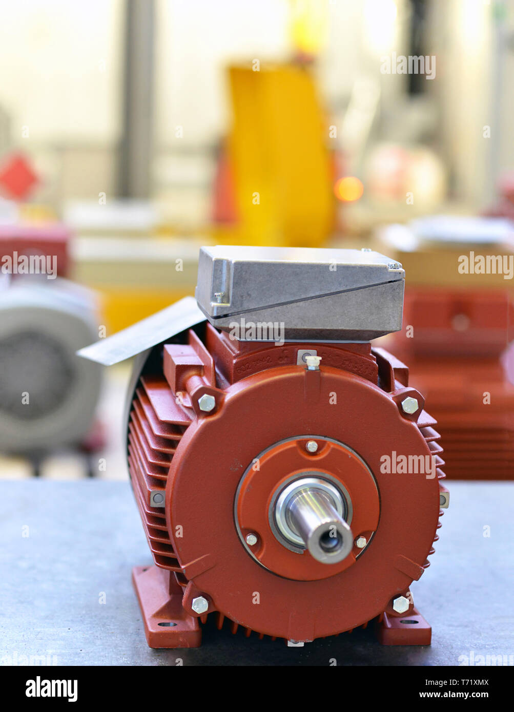 mechanical engineering: closeup of electric motors in production in a ...