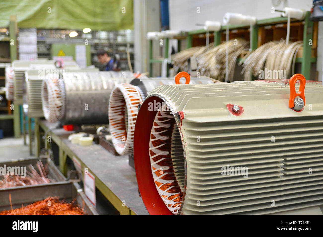 mechanical engineering: closeup of electric motors in production in a ...
