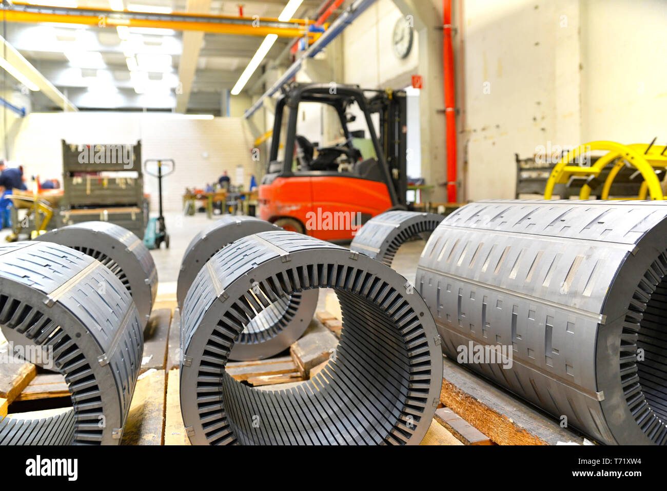 mechanical engineering: closeup of electric motors in production in a ...
