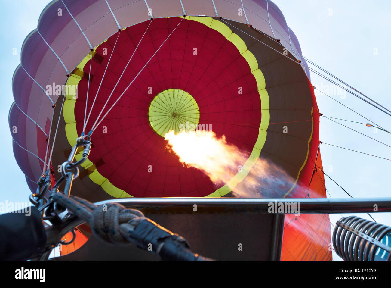 The balloon is blown inflate with fire from the torch, a long flame ...