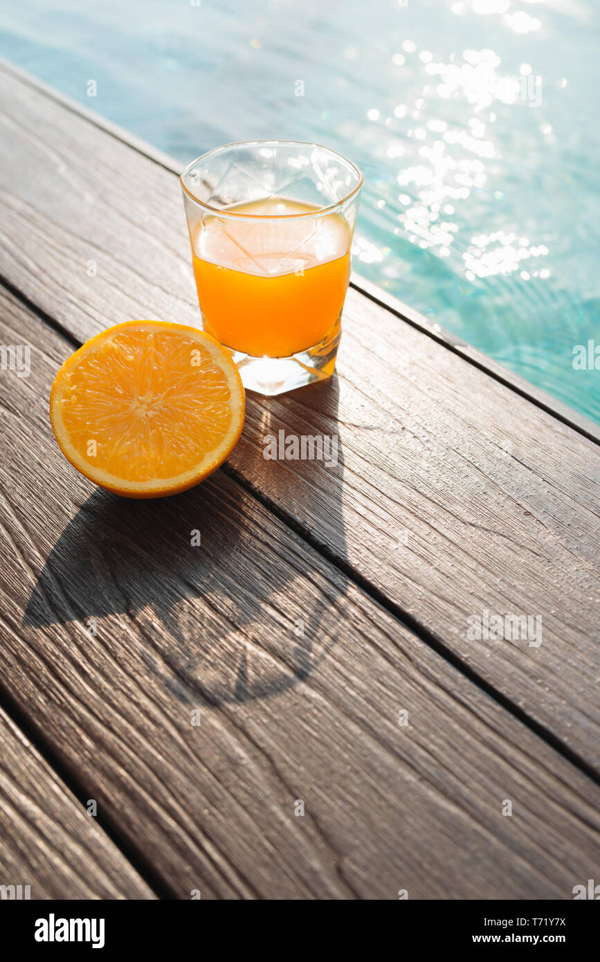 Orange juice around a swimming pool Stock Photo - Alamy