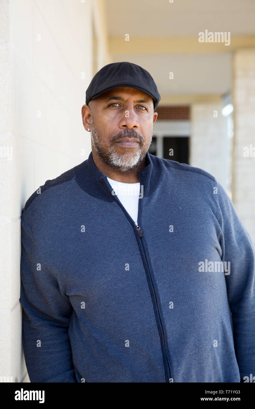 African American man standing alone looking sad Stock Photo - Alamy