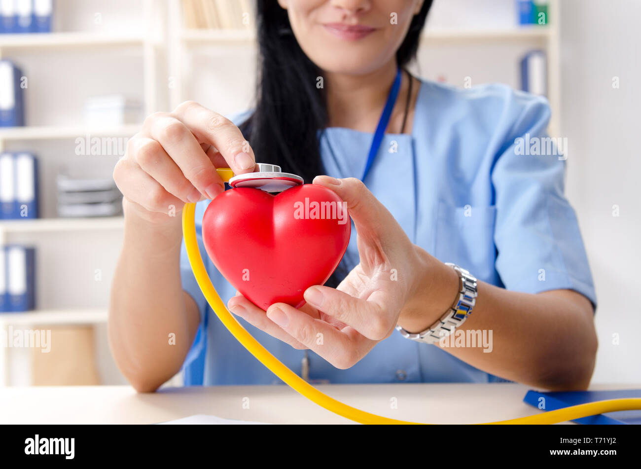 Female doctor cardiologist working in the clinic Stock Photo - Alamy