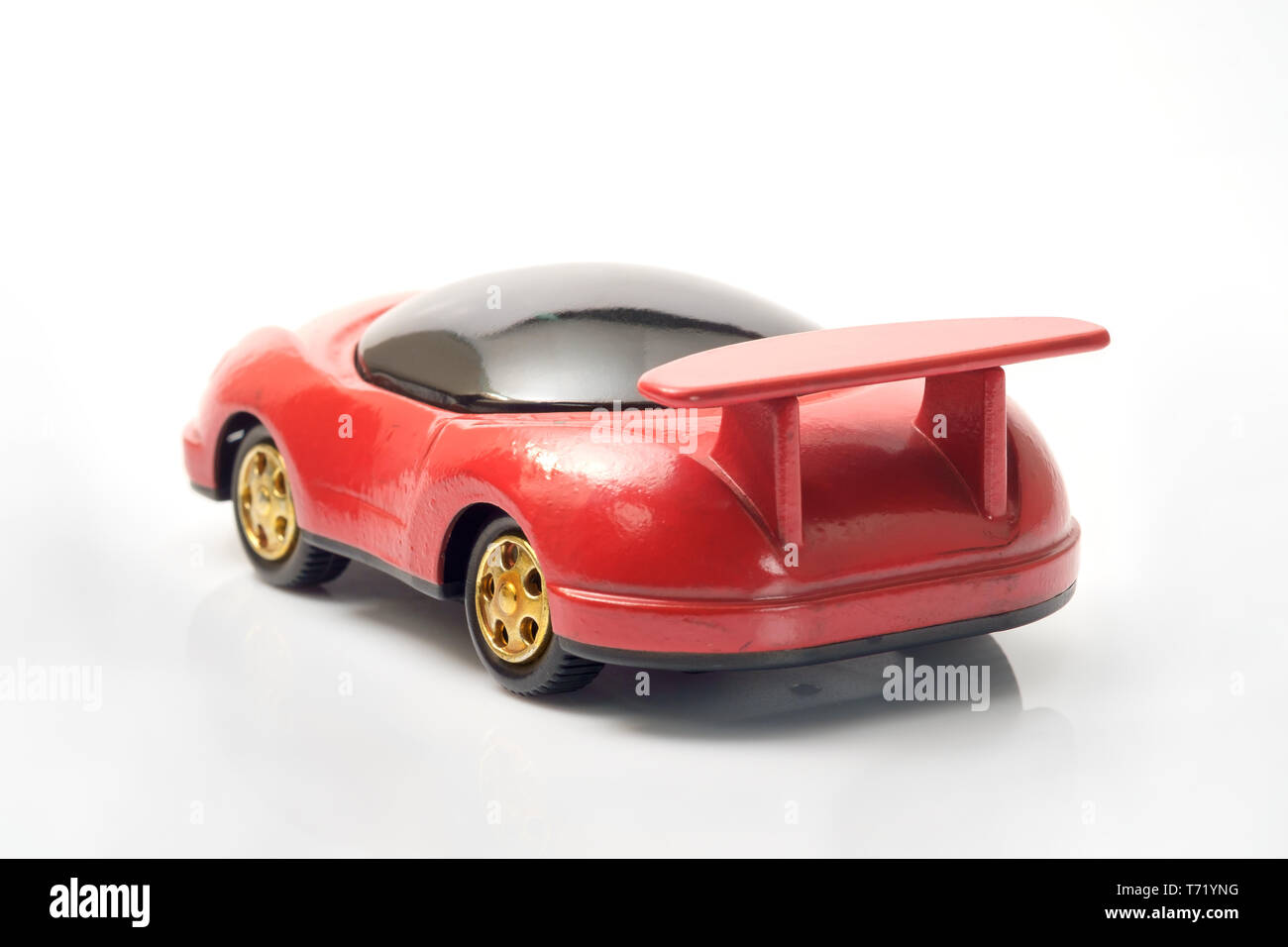 Toy red car on white background Stock Photo - Alamy