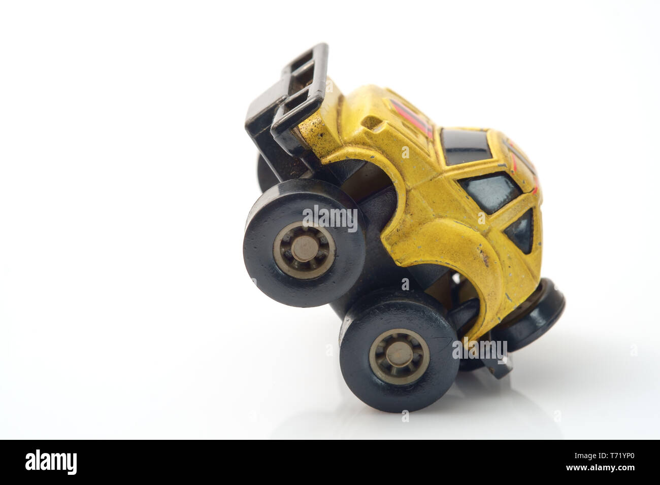 Toy yellow car on white background Stock Photo - Alamy