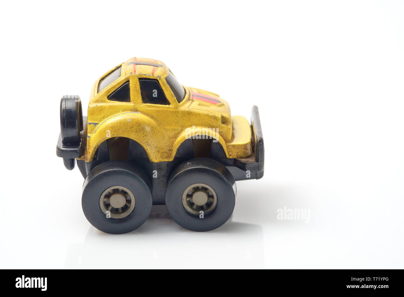 Toy yellow car on white background Stock Photo - Alamy