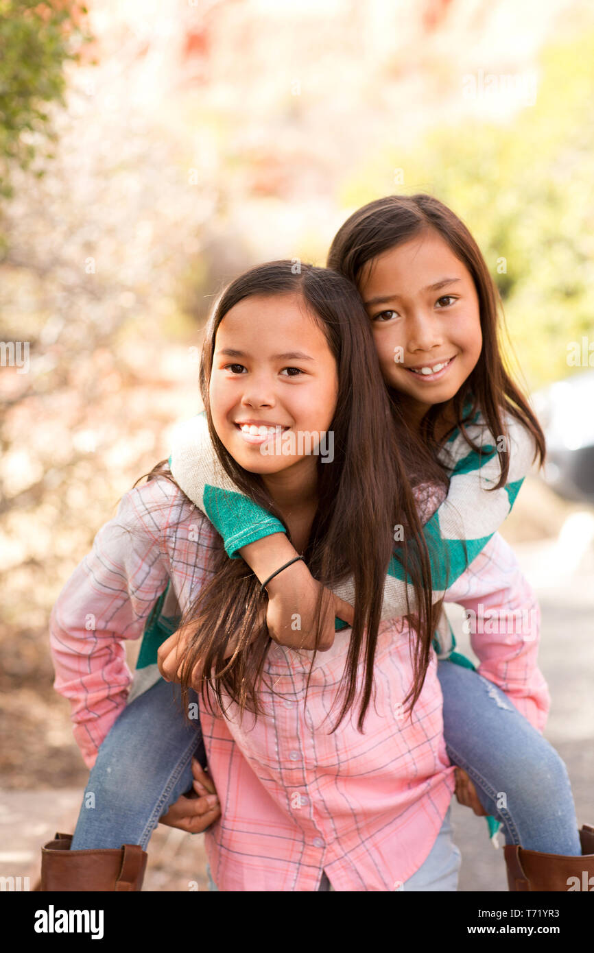 Portrait of two happy sisters smiling Stock Photo - Alamy