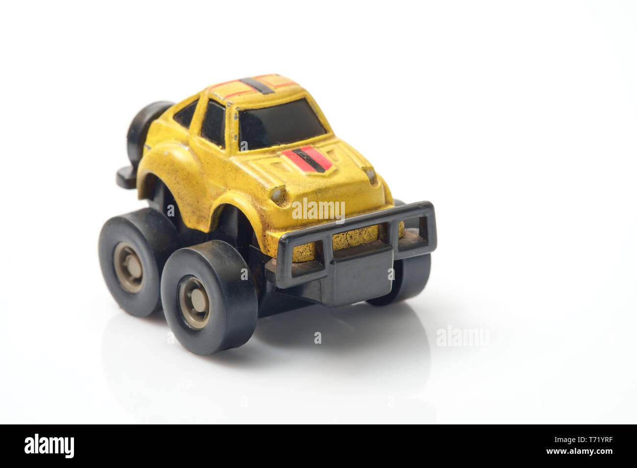 Toy yellow car on white background Stock Photo - Alamy
