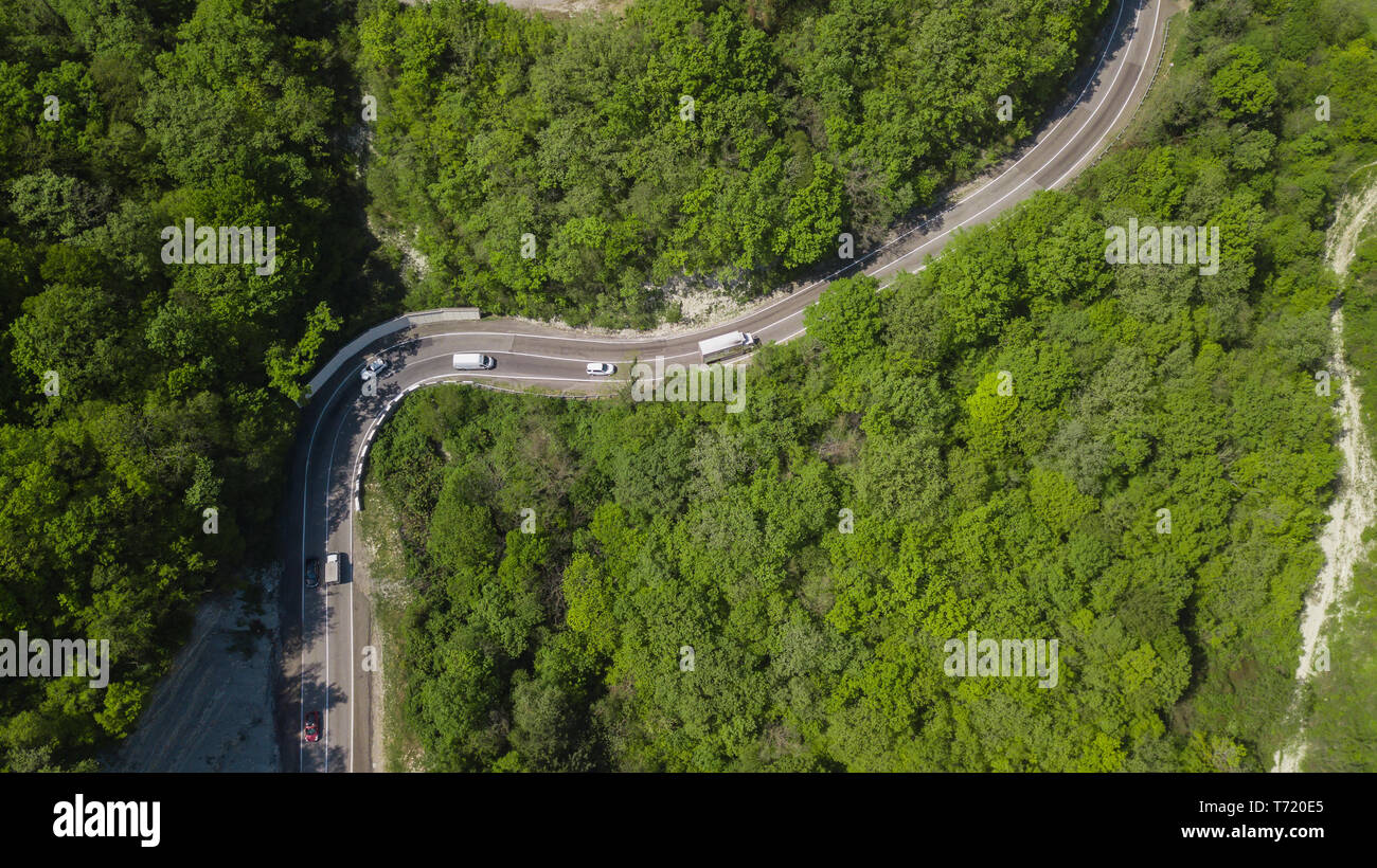 Top down view of a curvy road trough the mountains Stock Photo - Alamy