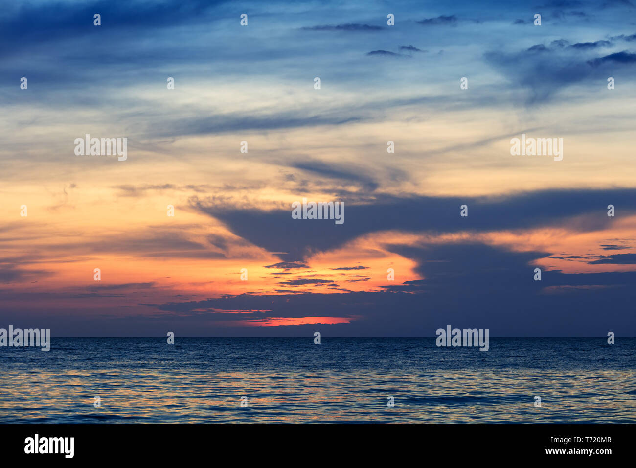 gorgeous red sunset over ocean Stock Photo - Alamy