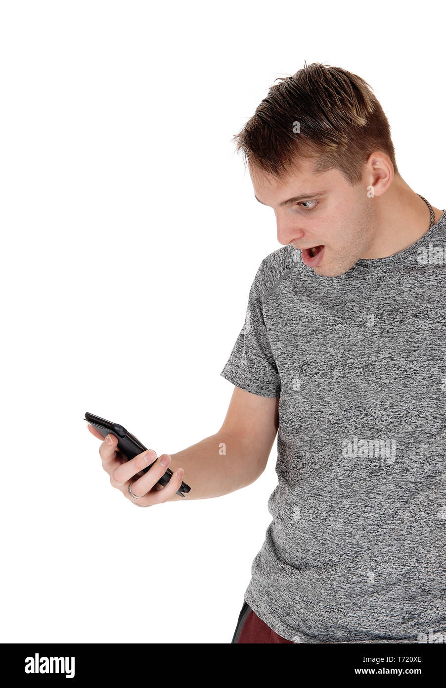 Guy looking at phone hi-res stock photography and images - Alamy