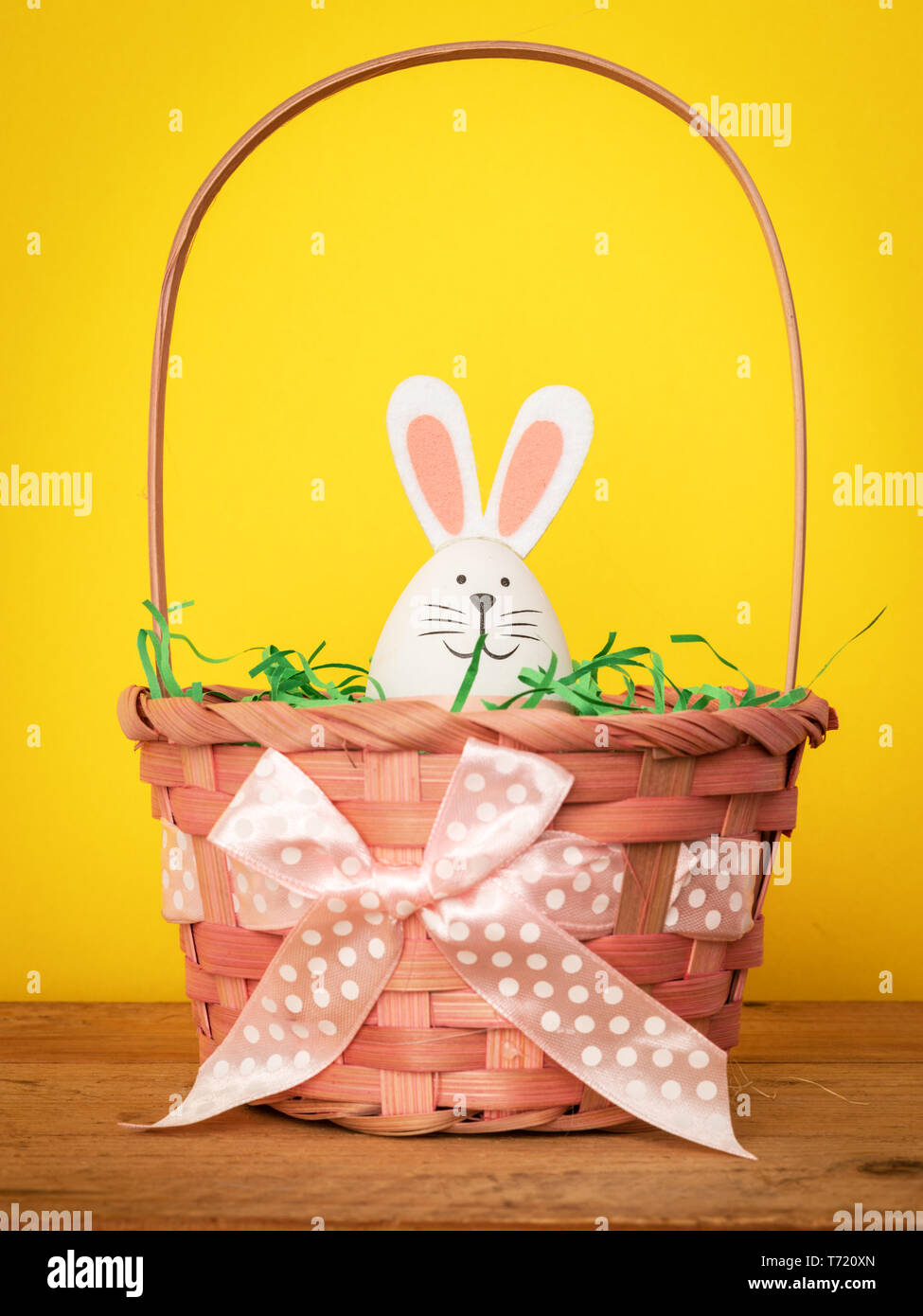 Easter bunny in basket hi-res stock photography and images - Alamy