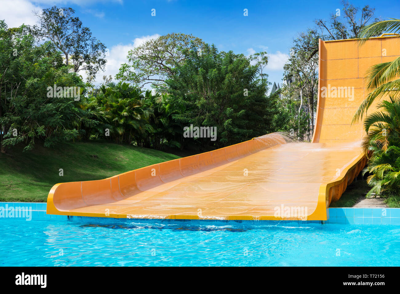 Modern water park yellow blue slide slides hi-res stock photography and ...